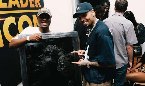 Artist gifts Chris Brown fine art portrait, while Rasta gains mixed ...
