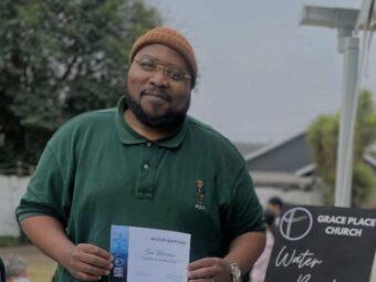 Stogie T Shares Heartfelt Baptism Moment with Son | Bona Magazine